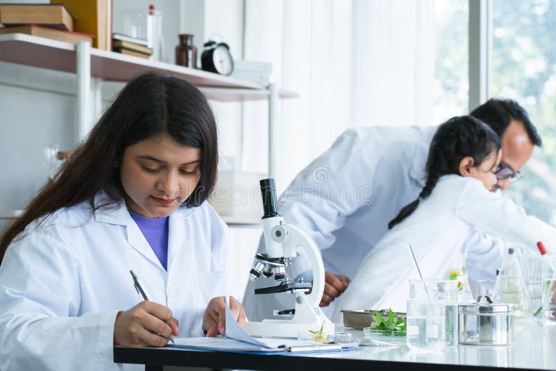 Indian Scientist Woman Student Using Microscope Do Experiment and ...
