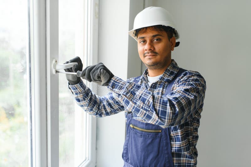 Indian Service Man Installing Window with Screwdriver Stock Image ... Indian Service Man Installing Window with Screwdriver Stock Image ...