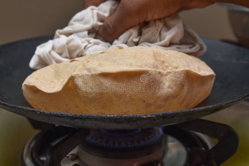 Making Roti Indian Chapati on Roti Tawa Made of Wheat Dough Stock Photo ...