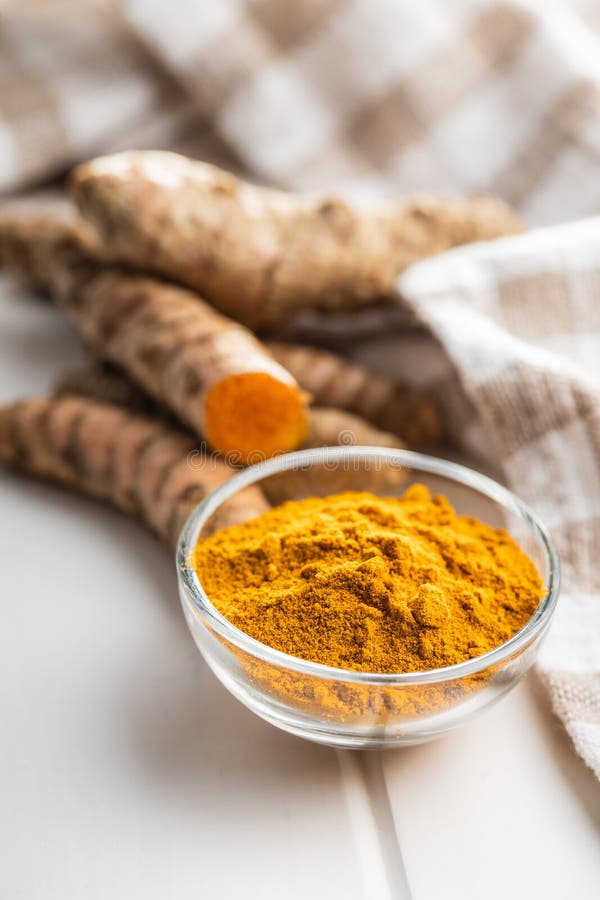 Indian Turmeric Powder and Root. Turmeric Spice. Ground Turmeric on ...