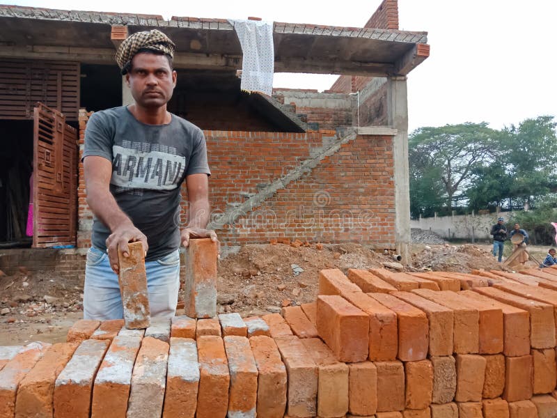 An Indian Village Man Worker Holded Bricks at Home Construction Site in ...