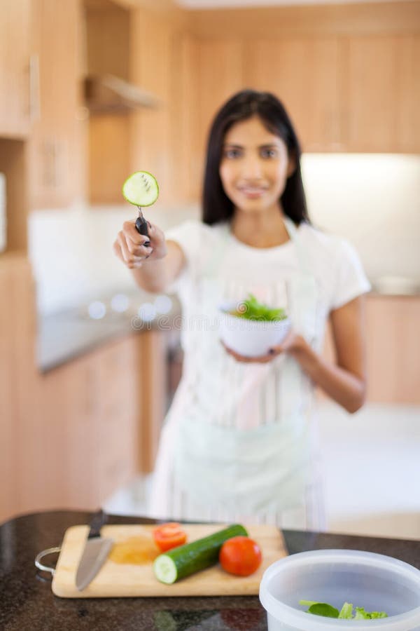 Indian woman in kitchen stock image. Image of chopping - 62115335