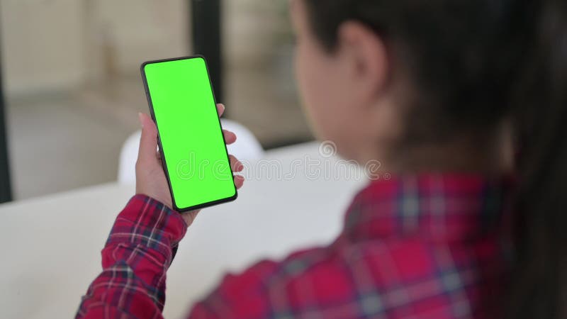 Indian Woman Looking At Smartphone With Chroma Screen Stock Image