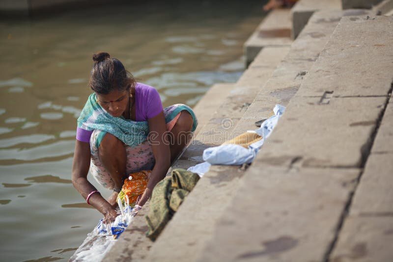 Indian Woman In Sari Washing Clothes In The River Editorial Photo