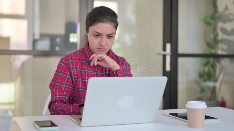 Indian Woman Thinking while Using Laptop Stock Photo - Image of idea ...