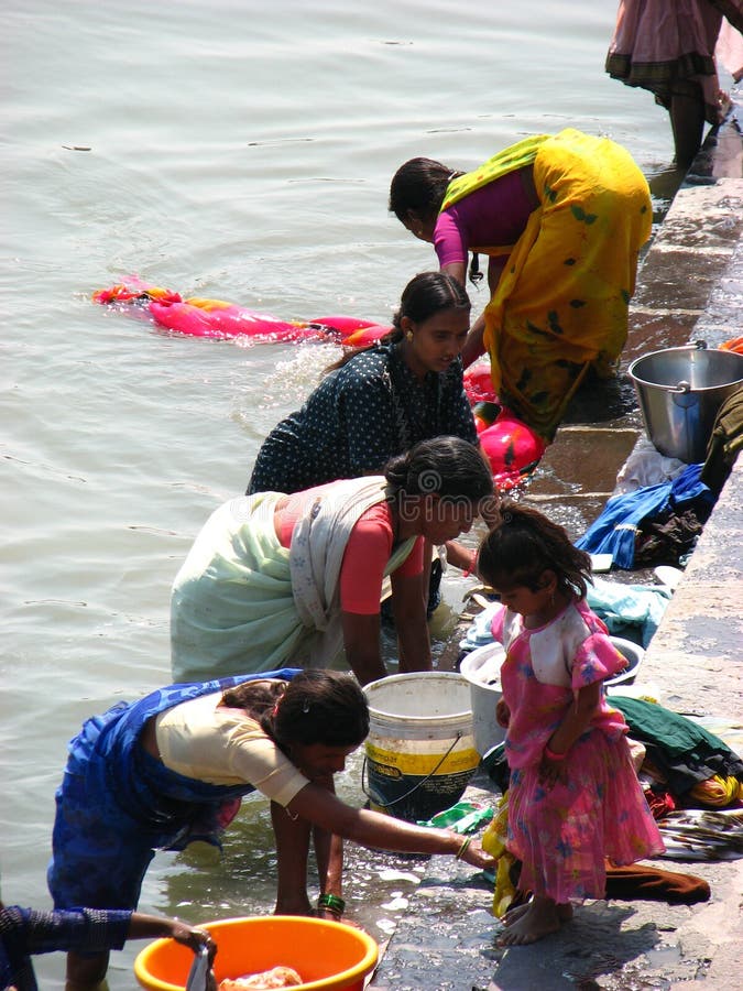 Indian Woman Washing Clothes, Poor Indian woman washing clothes on the ...