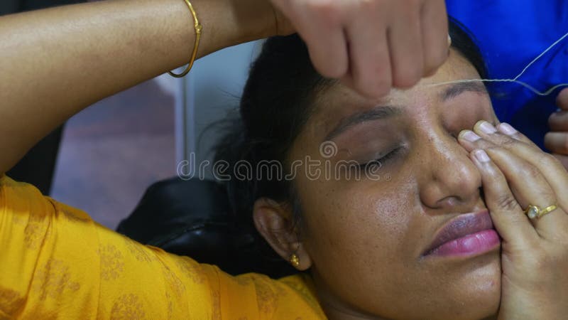 A Indian Women Straightening the Eyebrows Stock Video - Video of ...