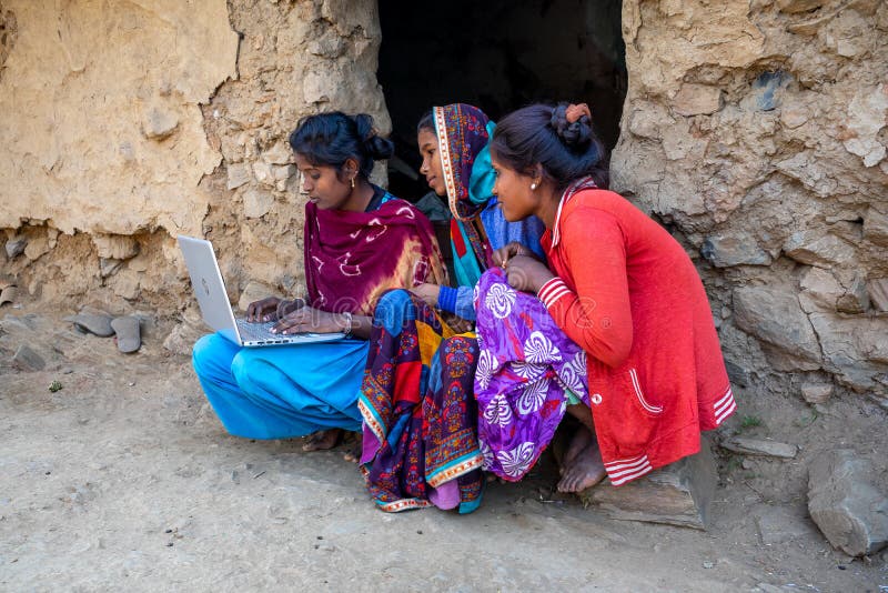 Indian women using laptop editorial photography. Image of rural - 202593357