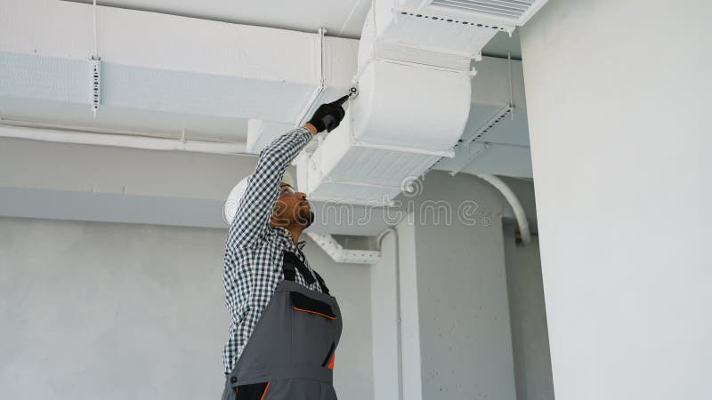 Indian Hvac Technician at Work. Ventilation, Heating System Maintenance ...