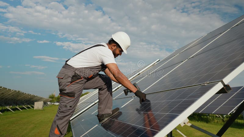 Indian Worker Installing Solar Panels at a Solar Energy Site Stock ...