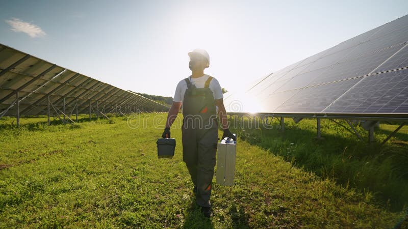 Indian Worker Walking between Solar Panels with Tools in Hand Stock ...