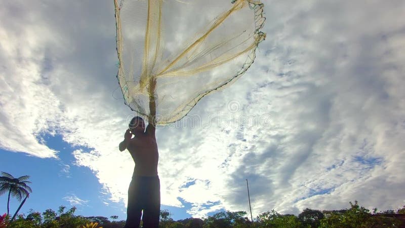 Indigenous Man Throwing a Fishing Net in the River Stock Footage ...