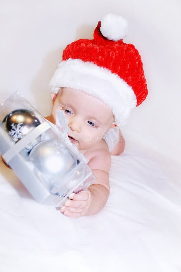 Indigo Christmas Baby. Present Stock Image - Image of fingers, clothes ...