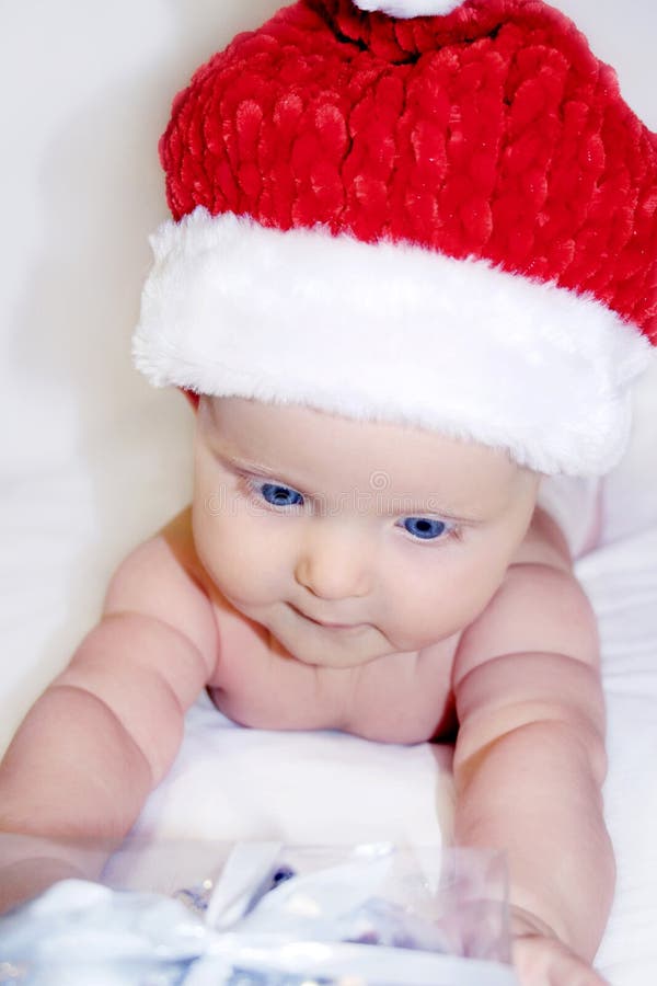Indigo Christmas Baby is Taking a Present. Stock Photo - Image of ...