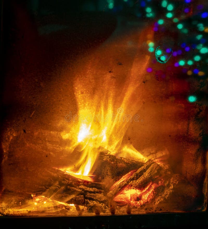 Indistinct Burning Fire in the Fireplace through the Fire Glass with ...