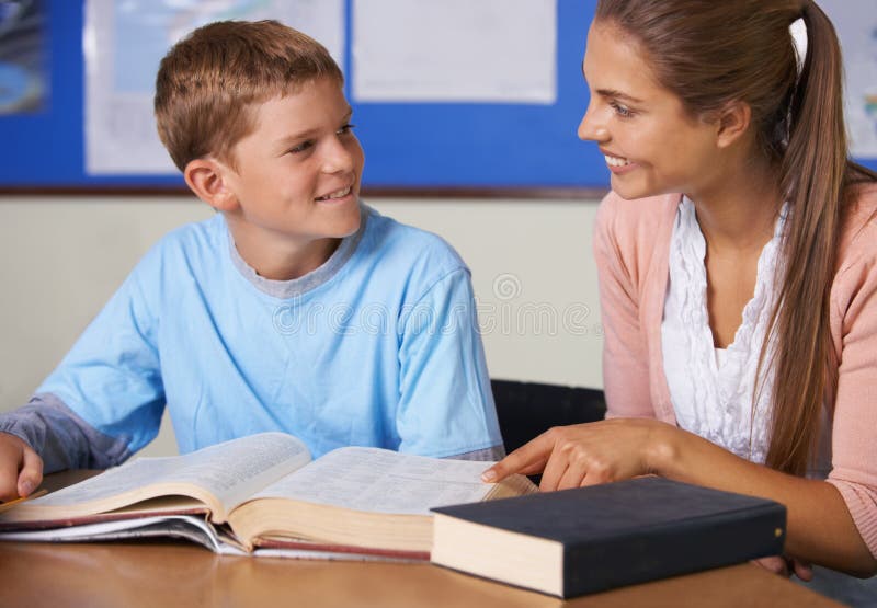 Individual Attention Makes All the Difference. a Beautiful Teacher Explaining Something To Her ...
