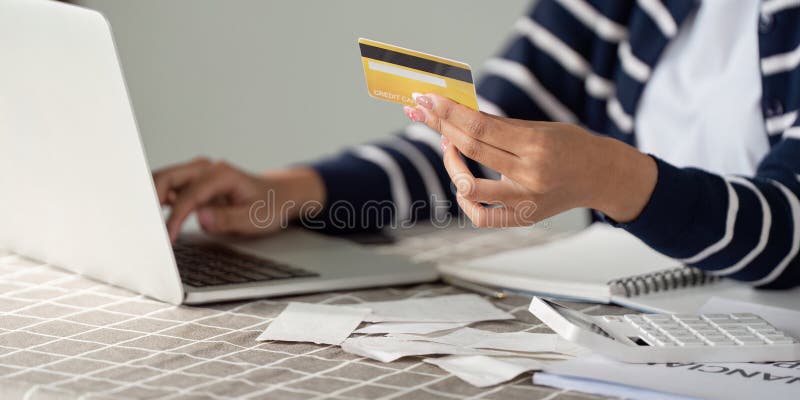 Individual Calculating Finances and Planning Bills with Calculator and ...