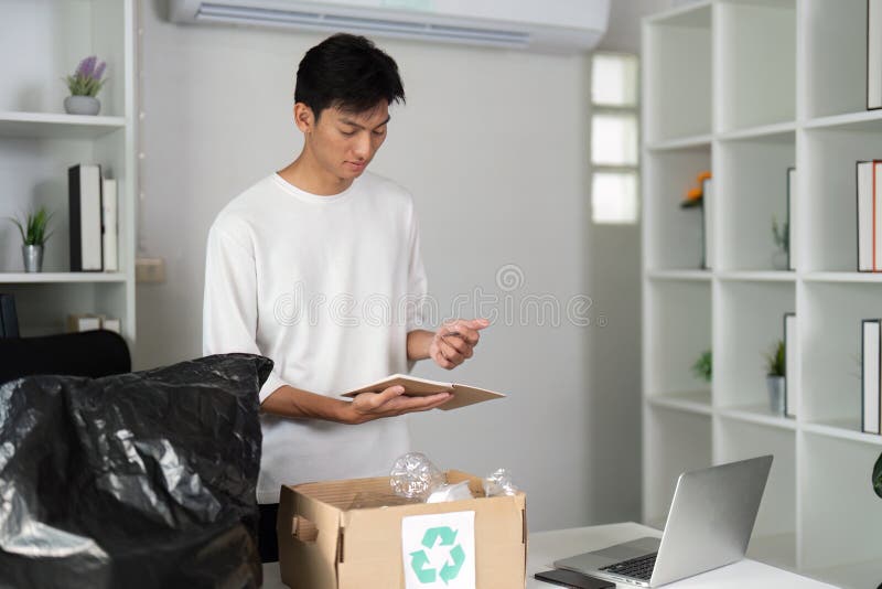 Environmental Conservation and Recycling. a Person Examining Items for ...