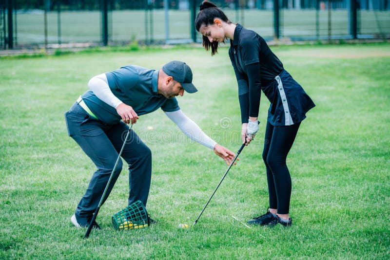 Individual Golf Lesson. Young Woman Having a Golf Lesson with Golf ...