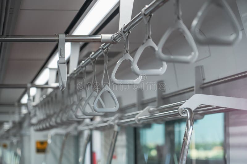 Individual Handles on Metal Handrails Inside the Train. Stock Photo ...