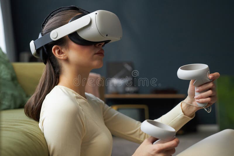 Experiencing Virtual Reality with Headset and Controllers Stock Photo ...