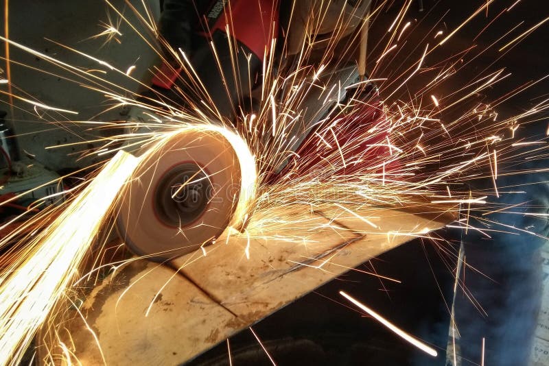 Individual Operating a Metal Cutting Machine in a Manufacturing Plant ...