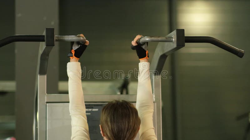 Strength Training Session at the Gym with Focus on Pull-Ups and Upper ...
