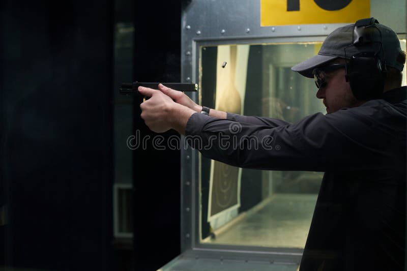 Practicing Shooting at Indoor Gun Range Stock Image - Image of action ...