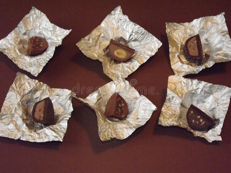 Individual Silver Wrapped Chocolates with Different Fillings in a Box ...