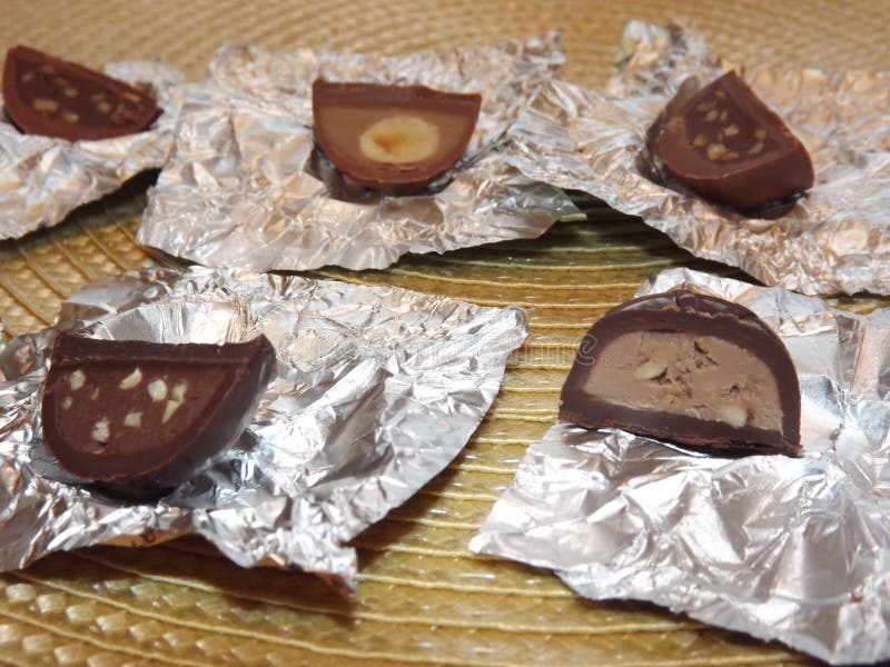 Individual Silver Wrapped Chocolates with Different Fillings in a Box ...