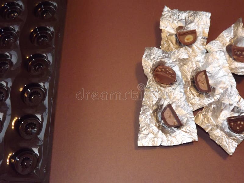 Individual Silver Wrapped Chocolates with Different Fillings in a Box ...