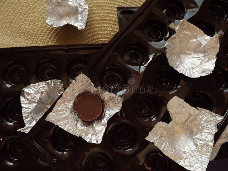 Individual Silver Wrapped Chocolates with Different Fillings in a Box ...