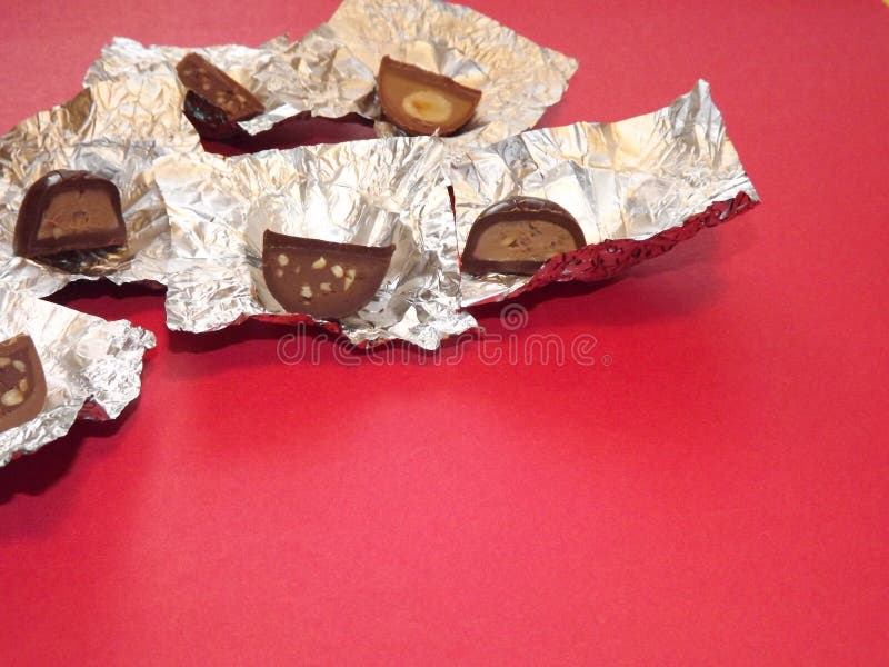 Individual Silver Wrapped Chocolates with Different Fillings in a Box ...