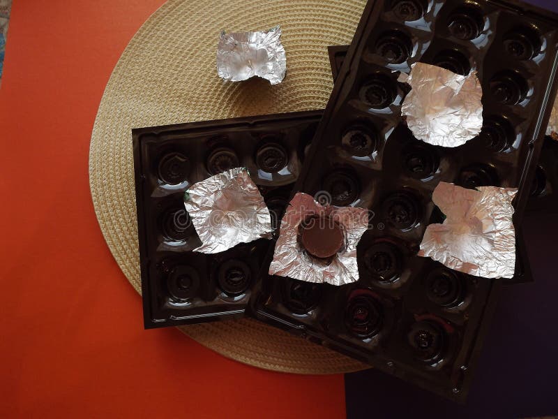 Individual Silver Wrapped Chocolates with Different Fillings in a Box ...