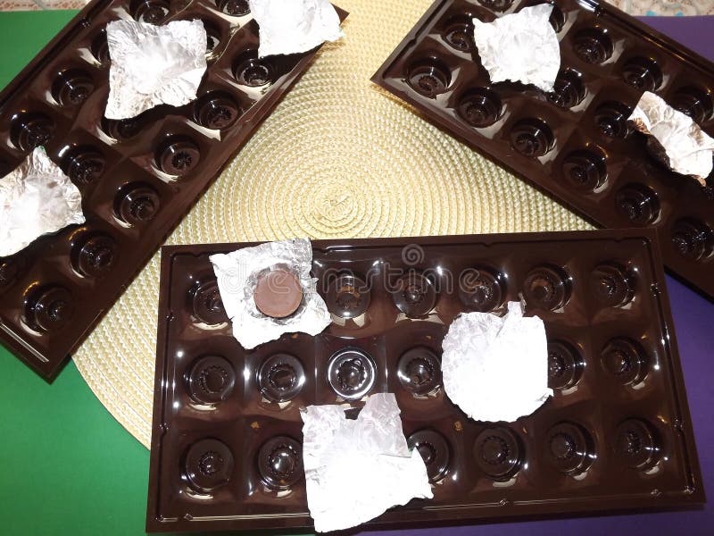 Individual Silver Wrapped Chocolates with Different Fillings in a Box ...