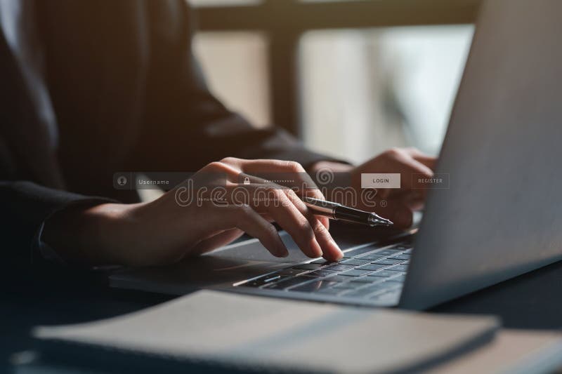 An Individual is Typing on a Keyboard Laptop Showing a Hologram ... An Individual is Typing on a Keyboard Laptop Showing a Hologram ...