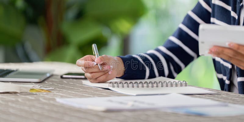 Focused Woman Working on a Laptop at Home, Planning Finances and ...