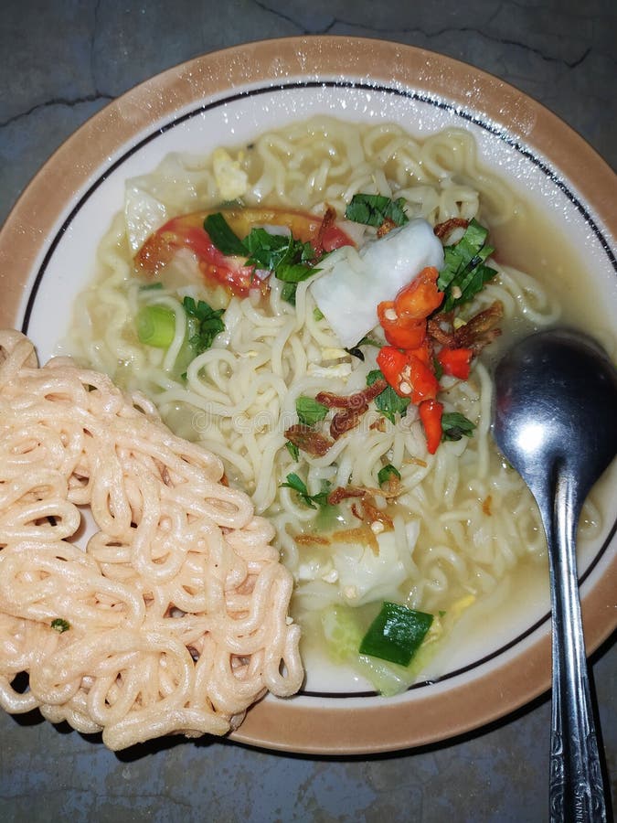 Indomie Gravy with Chili Egg Topping and Crackers Stock Photo - Image ...