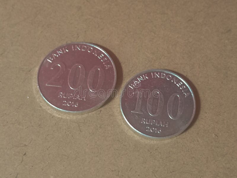 Indonesia Silver Coins, Denomination of 100 and 200 Rupiah Stock Photo ...