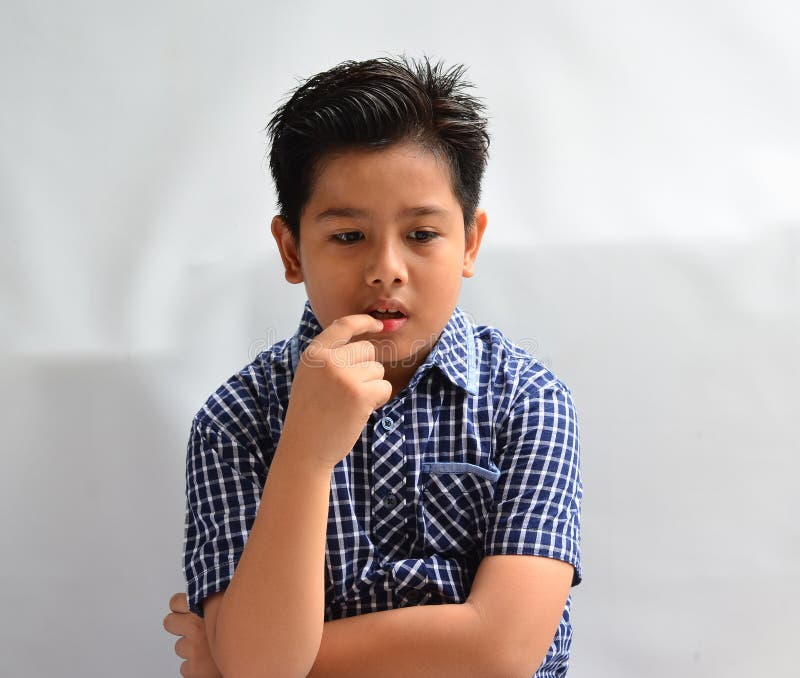 Indonesian Boy with Thinking Something Expression Stock Photo - Image ...