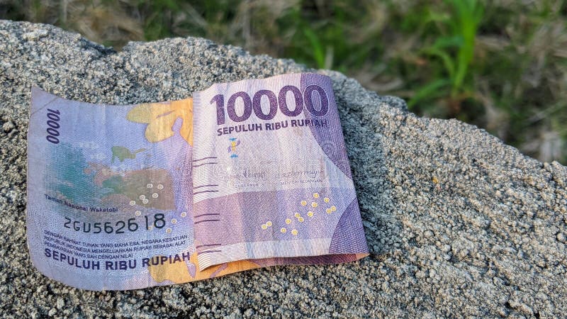 Indonesian Currency in 10000 Rupiah . Stock Image - Image of flooring ...