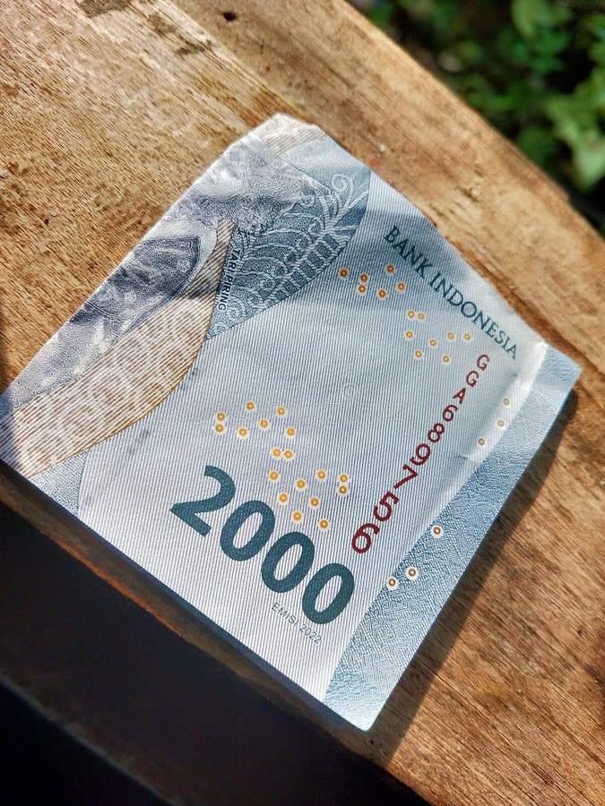 Indonesian Currency 2000 Rupiah with Wooden Desk Stock Photo - Image of ...