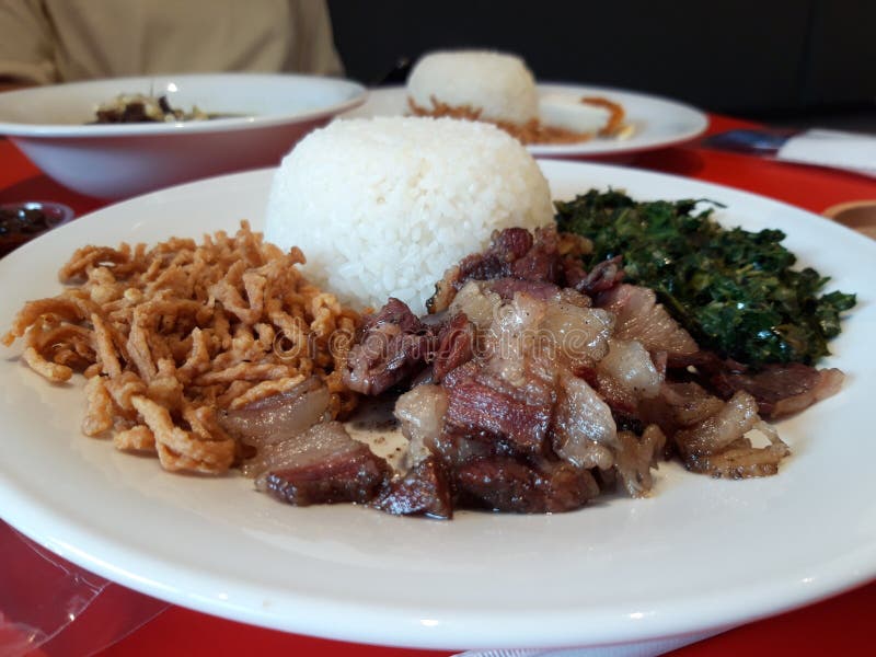 Indonesian Food Sei Sapi with Cassava Leaf Stock Photo - Image of ...