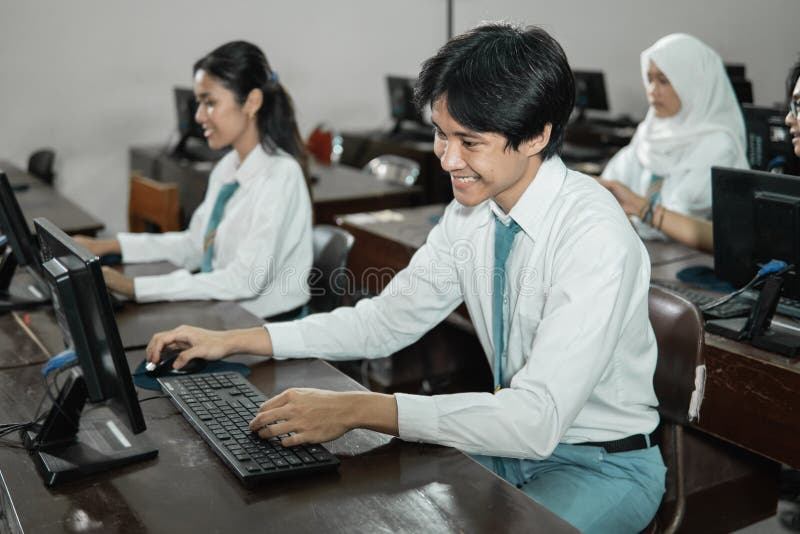 Indonesian High School Students Smile while Using a Computer Pc with ...