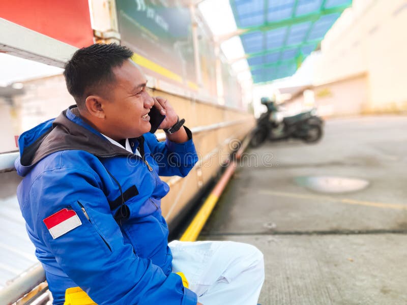 Indonesian Man Who is Making a Phone Call Stock Photo - Image of ...