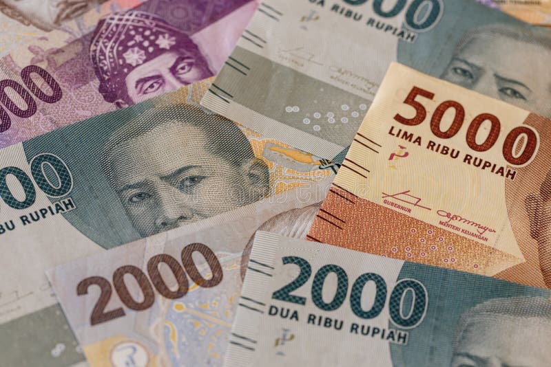 Indonesian Rupees, New, Different Denominations Scattered on the Table ...