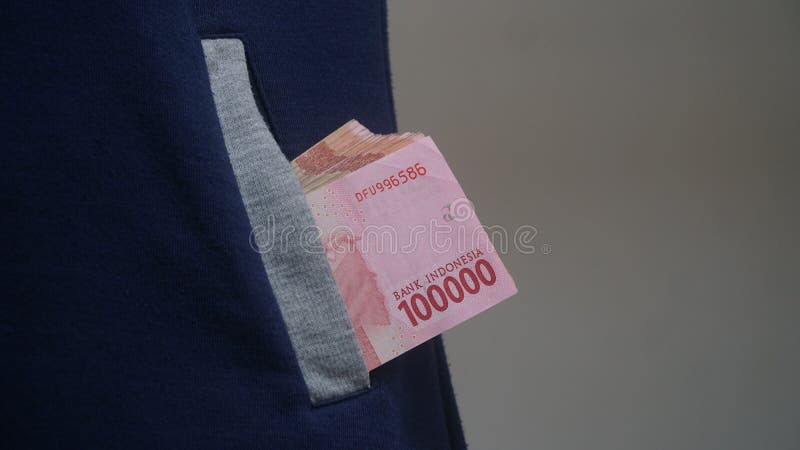 Indonesian Rupiah Banknote in Jacket Pocket, 100,000 Rupiah Stock Image ...