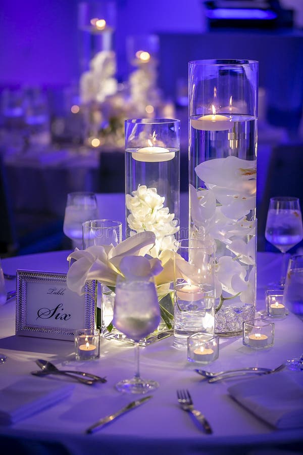 Indoor Evening Wedding Table Setting with Floating Candles in Glass ...