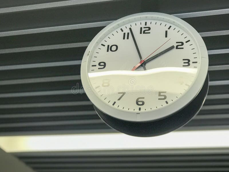 Hanging Round Clock in the Building Stock Image - Image of building ...