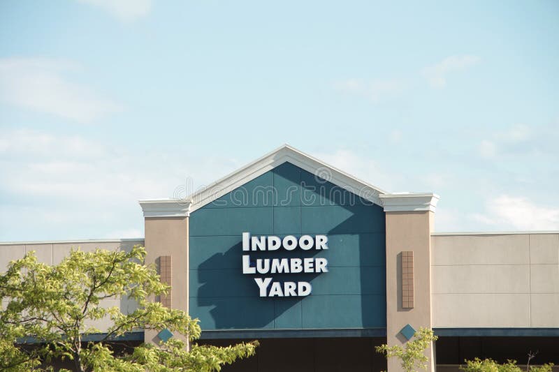 Indoor Lumber Yard Sign on Storefront with Parking Lot and Large Truck ...